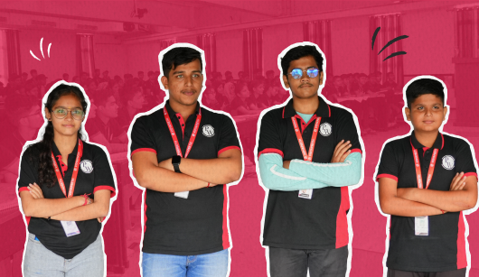 Group of students standing with arms crossed
